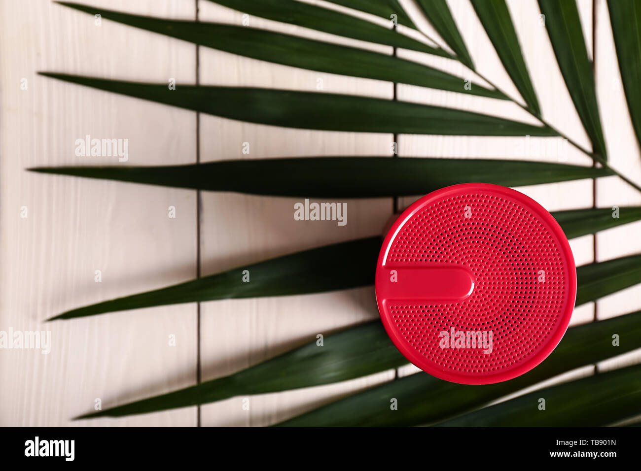 Smart home assistant device on white wooden table Stock Photo - Alamy