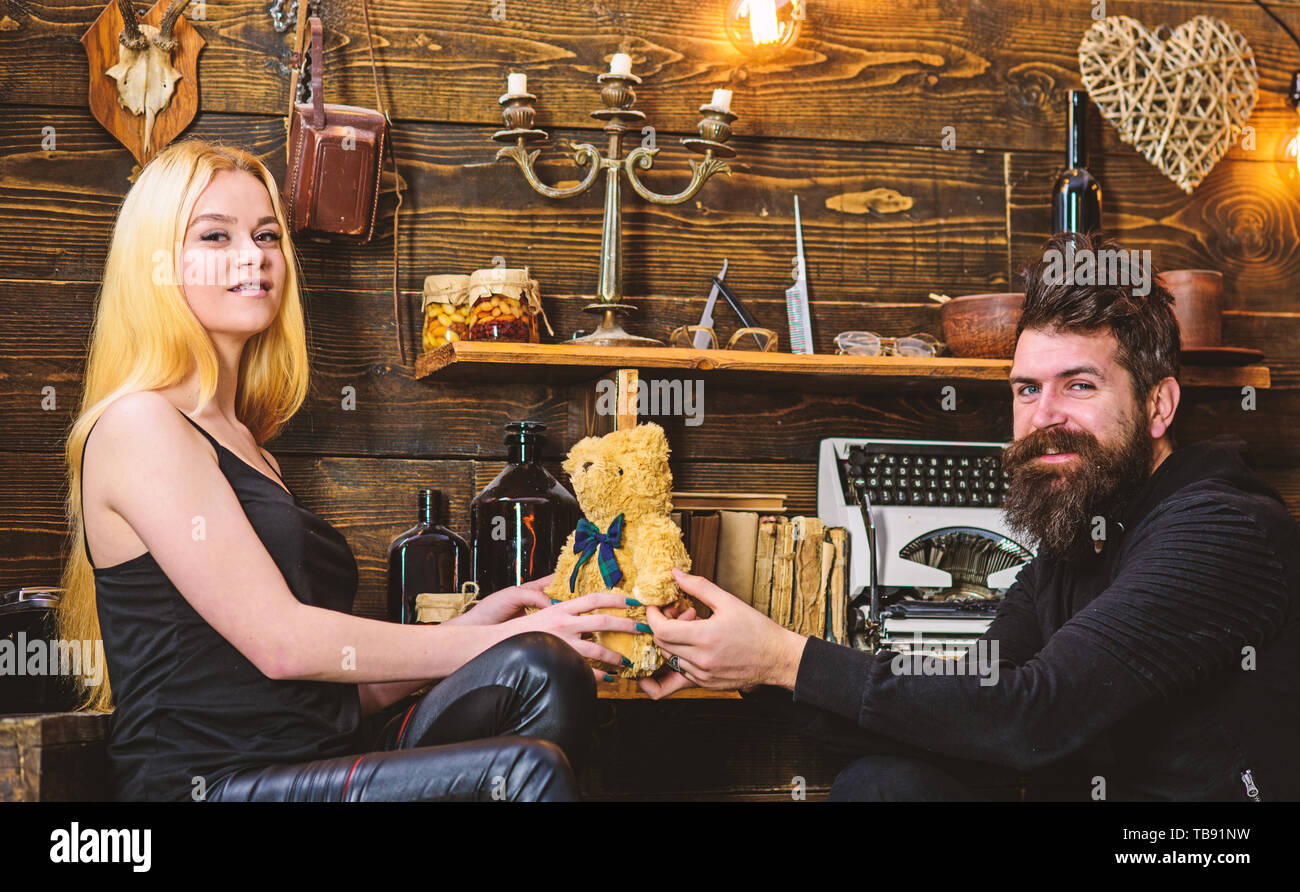 Man give to lady teddy bear as gift on anniversary. Couple in love on ...