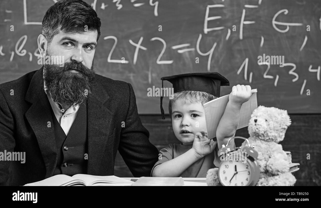 Father with beard, teacher teaches son, kid boy. Teaching kid concept ...