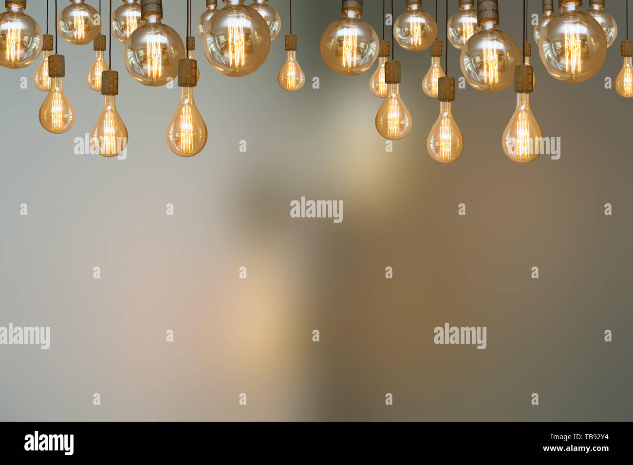 burning retro light bulb on blurred background colorful vintage design ...