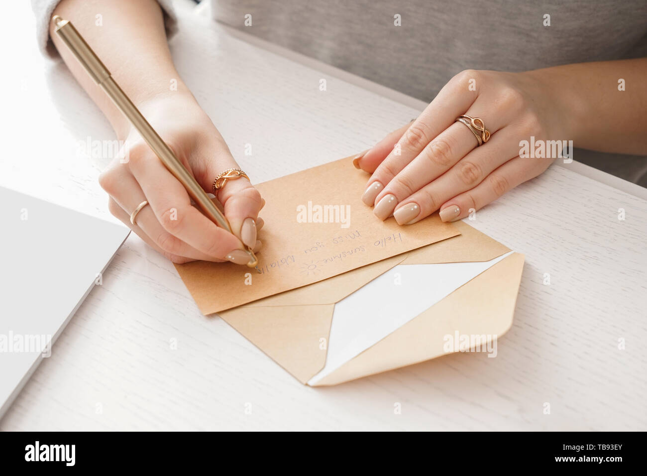 Woman writing letter hi-res stock photography and images - Alamy