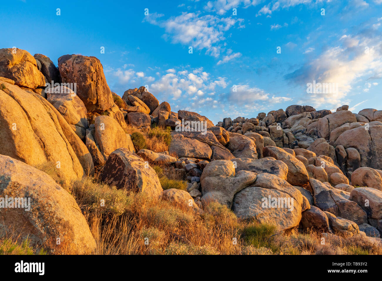 Large boulders on a hill during sunset lighting Stock Photo - Alamy