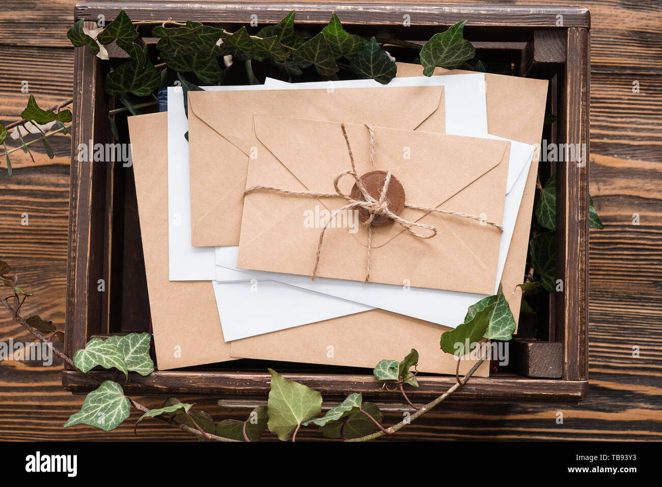 Box with many letters on wooden background Stock Photo - Alamy