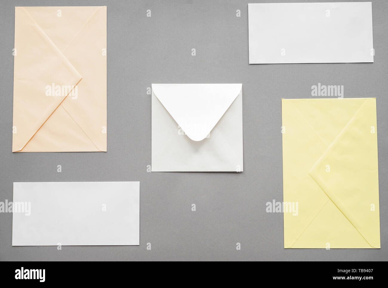 Many blank envelopes on grey background Stock Photo - Alamy
