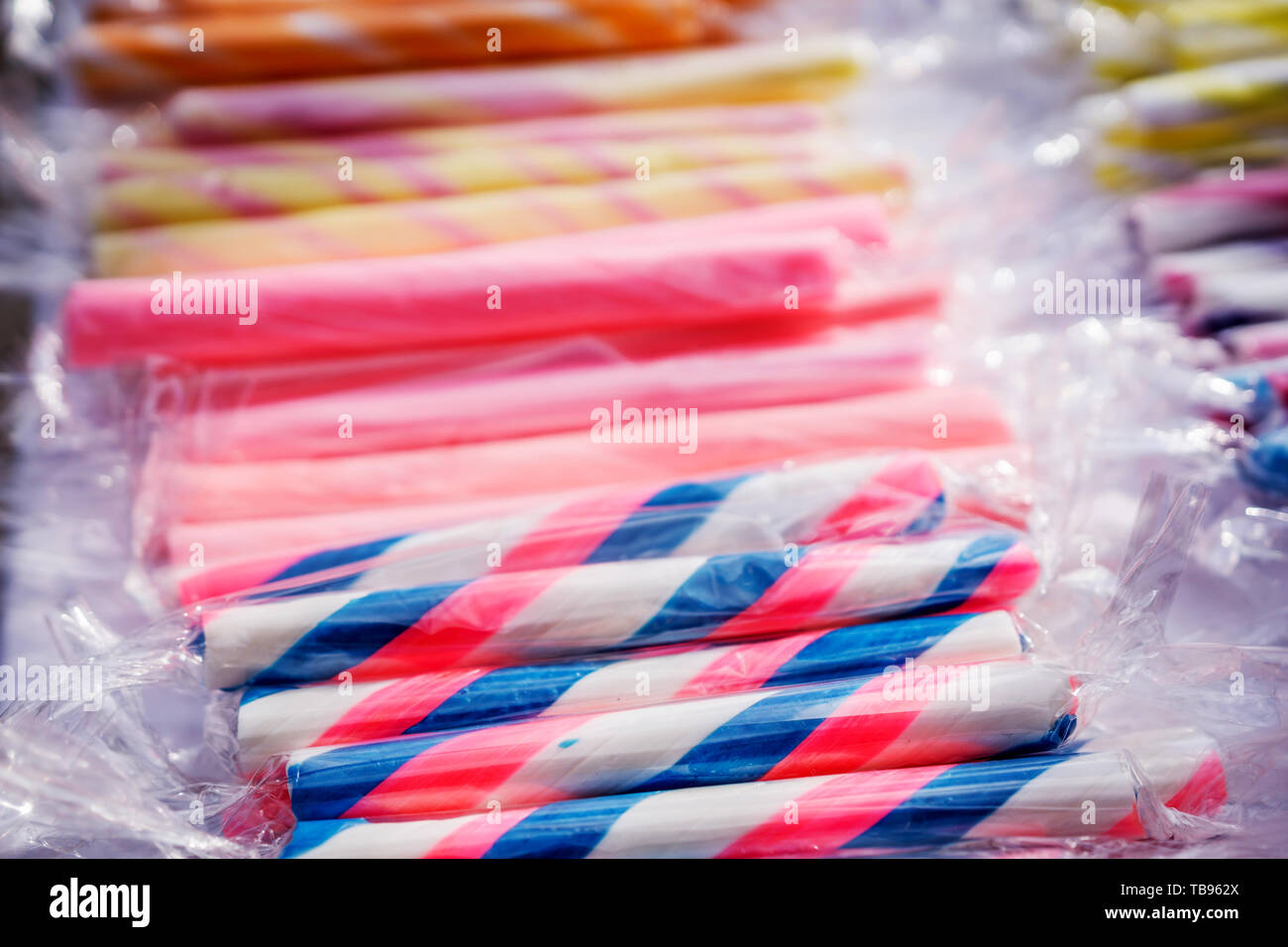 Close-up of colorful sugar sticks, sweet temptation in bright, fresh ...