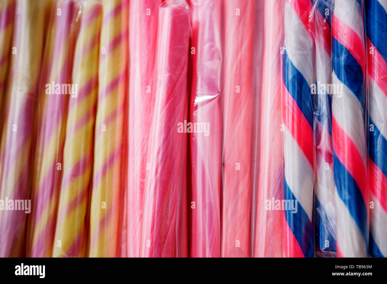 Close-up of colorful sugar sticks, sweet temptation in bright, fresh ...