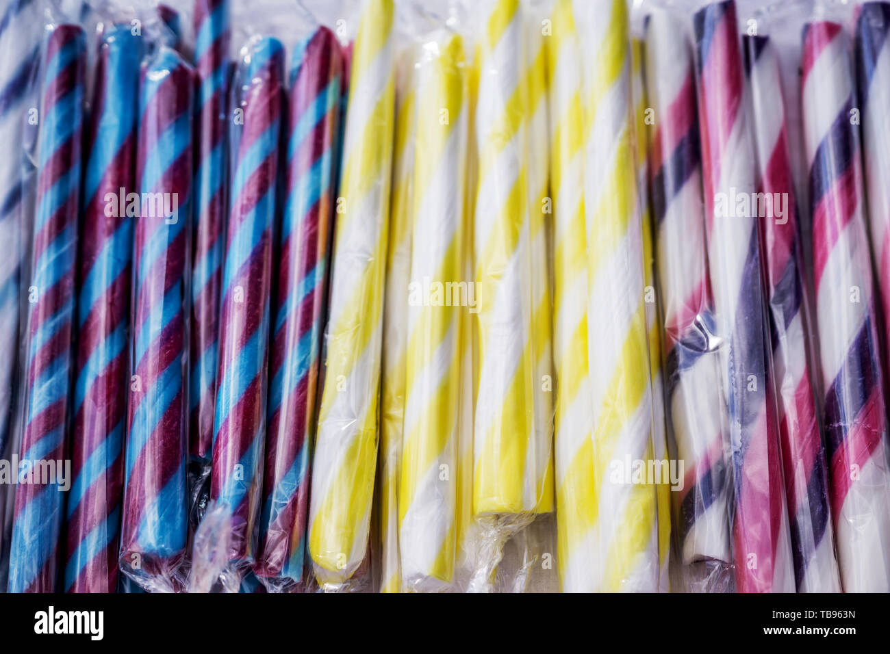 Close-up of colorful sugar sticks, sweet temptation in bright, fresh ...