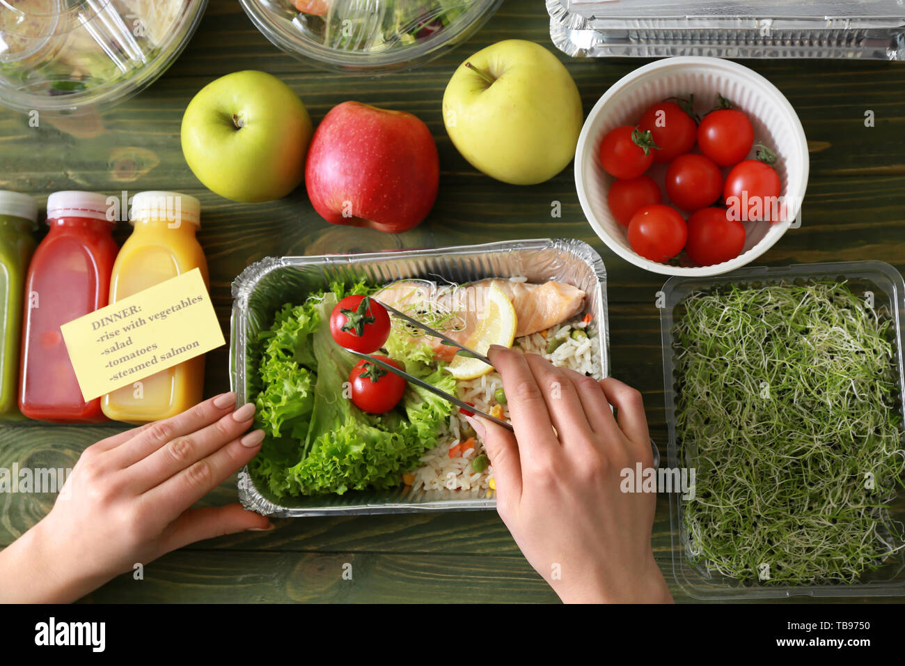 Worker of food delivery service packing order for customer Stock Photo ...