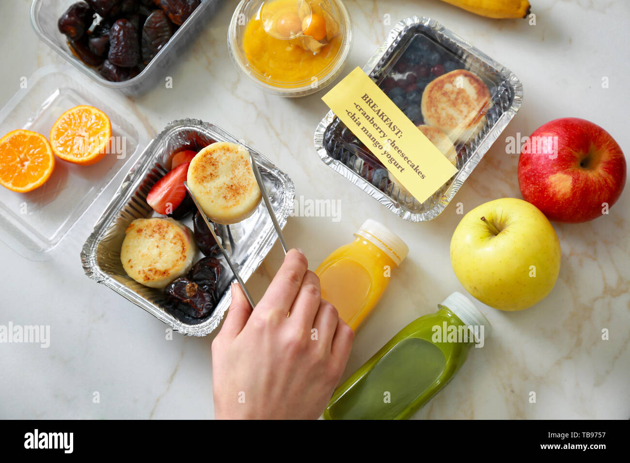 Worker of food delivery service packing order for customer Stock Photo ...