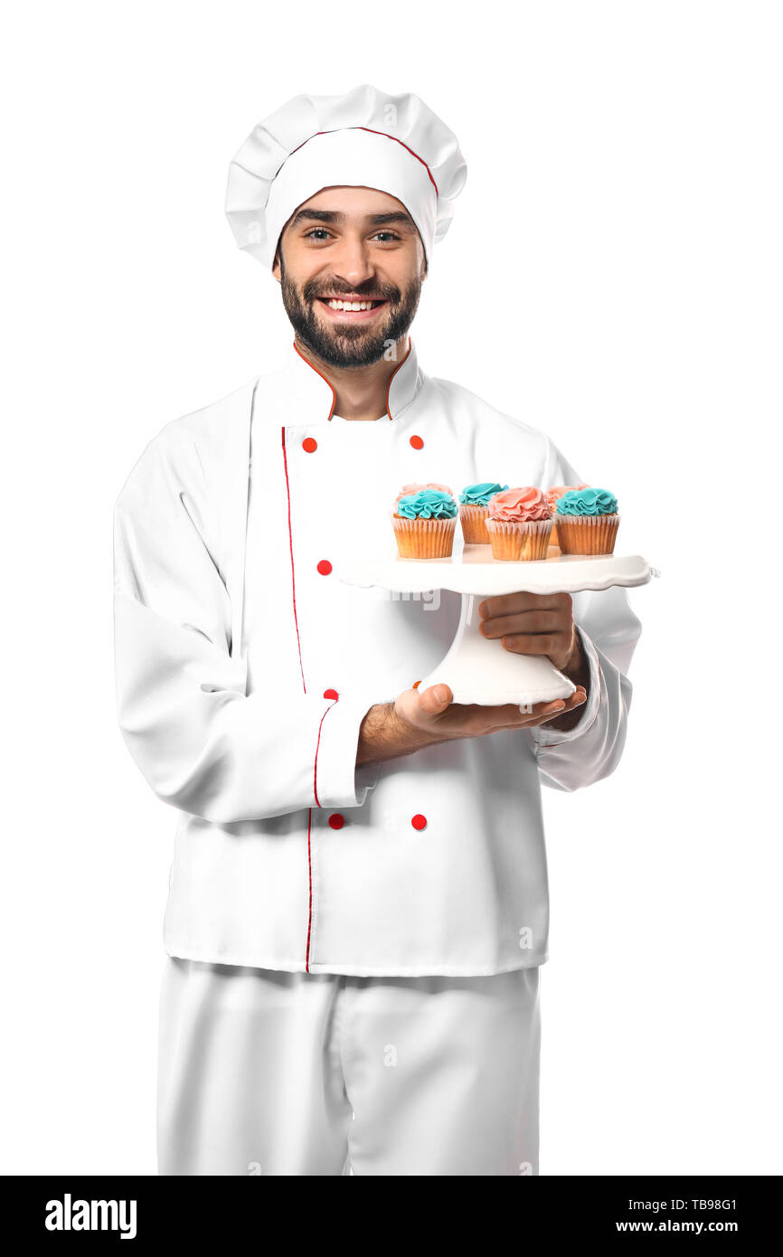 Male confectioner with tasty dessert on white background Stock Photo ...