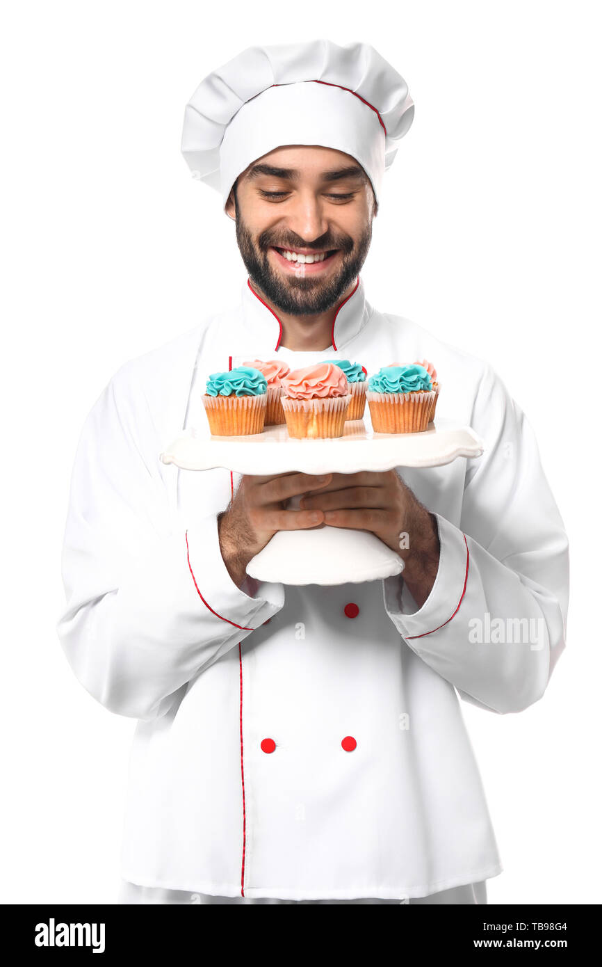 Male confectioner with tasty dessert on white background Stock Photo ...