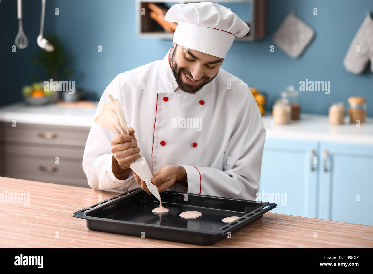 Male confectioner cooking tasty hi-res stock photography and images - Alamy