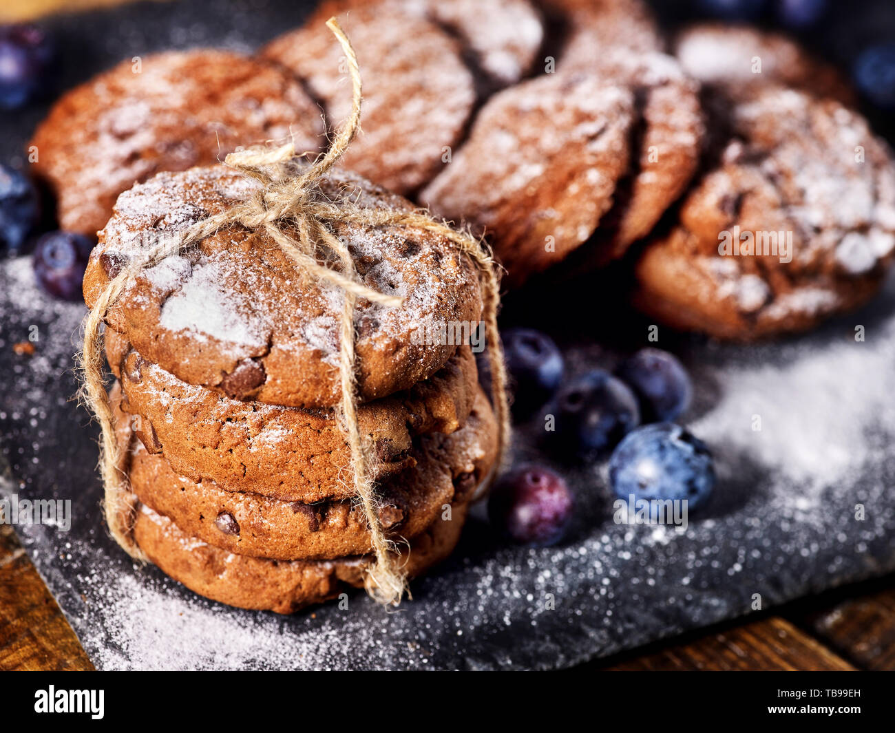 Chocolate chip cookies tied with string. Serving food on slate Stock ...
