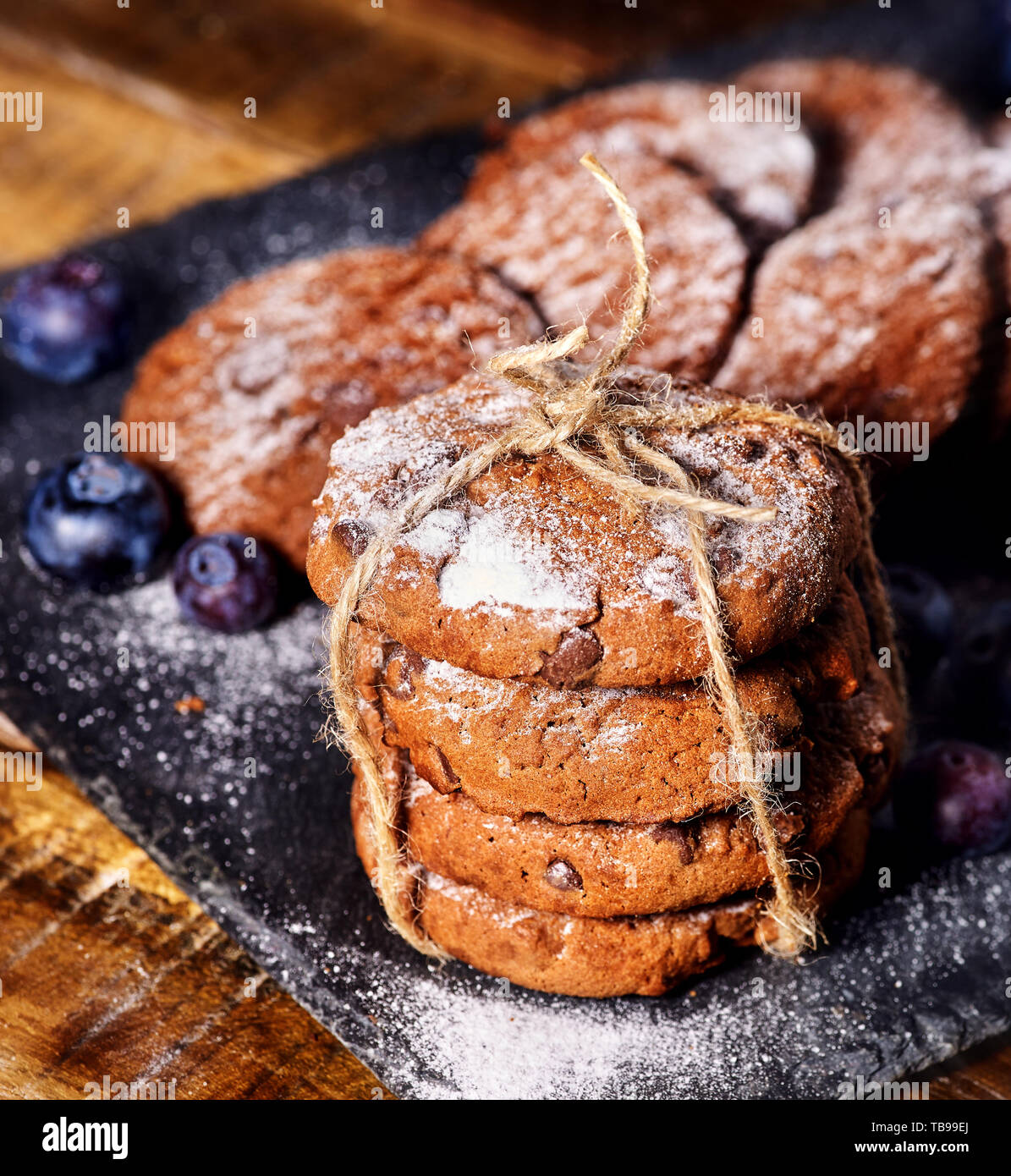 Chocolate chip cookies tied with string. Serving food on slate Stock ...