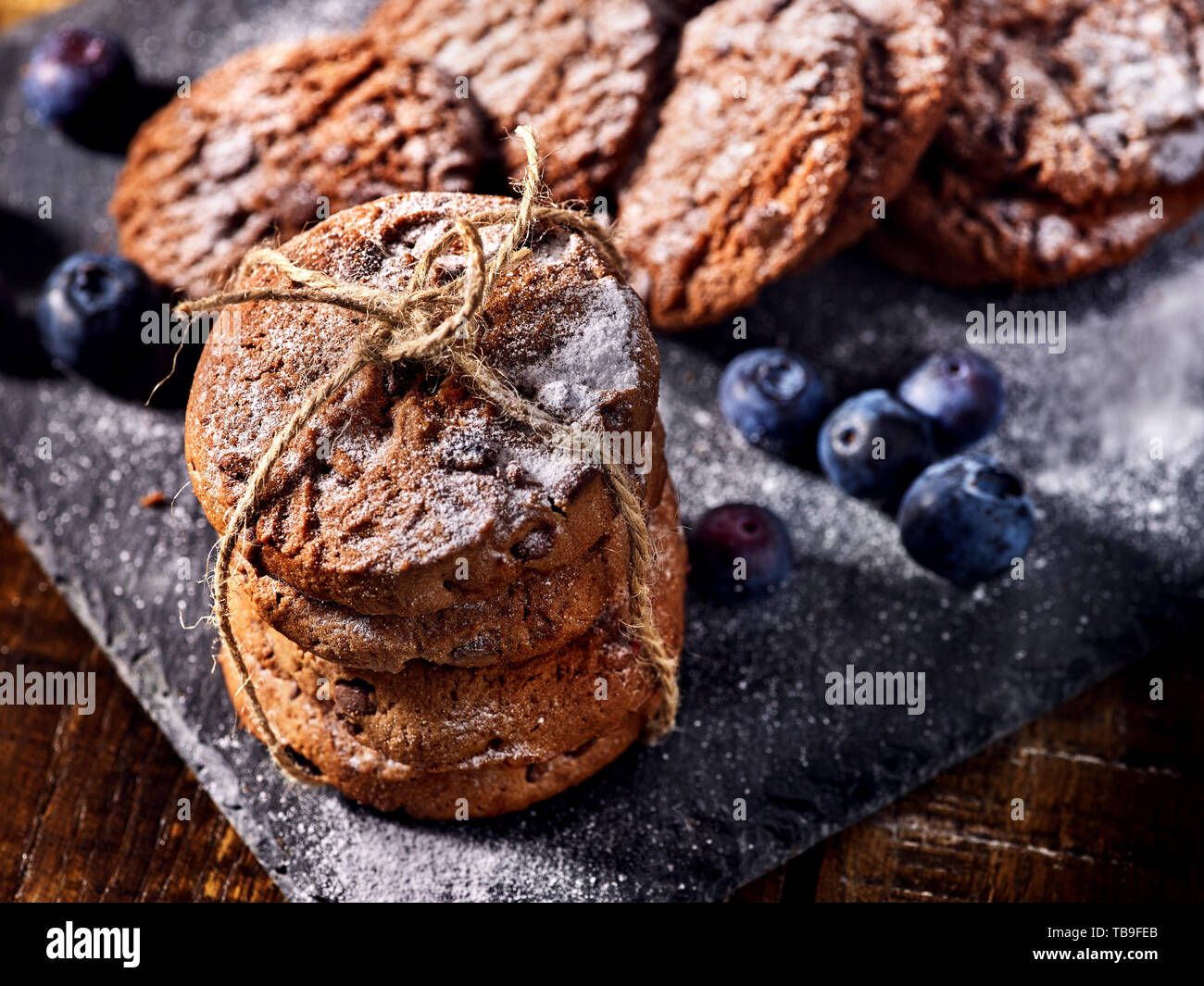 Chocolate chip cookies tied with string. Serving food on slate Stock ...
