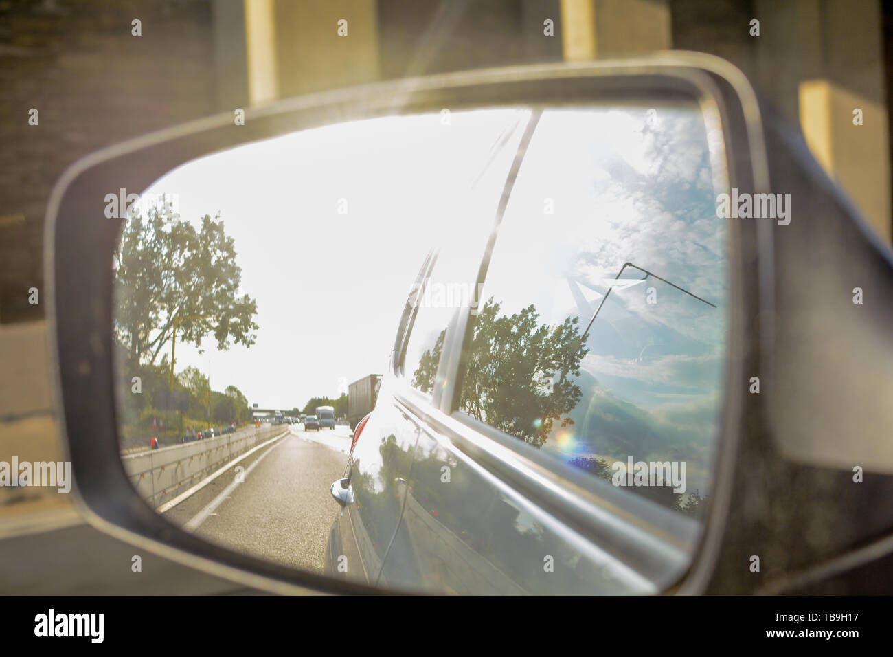 Looking in wing mirror hi-res stock photography and images - Alamy