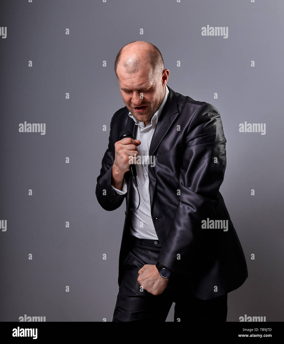 Fun emotional happy performer man presenting the show holding ...