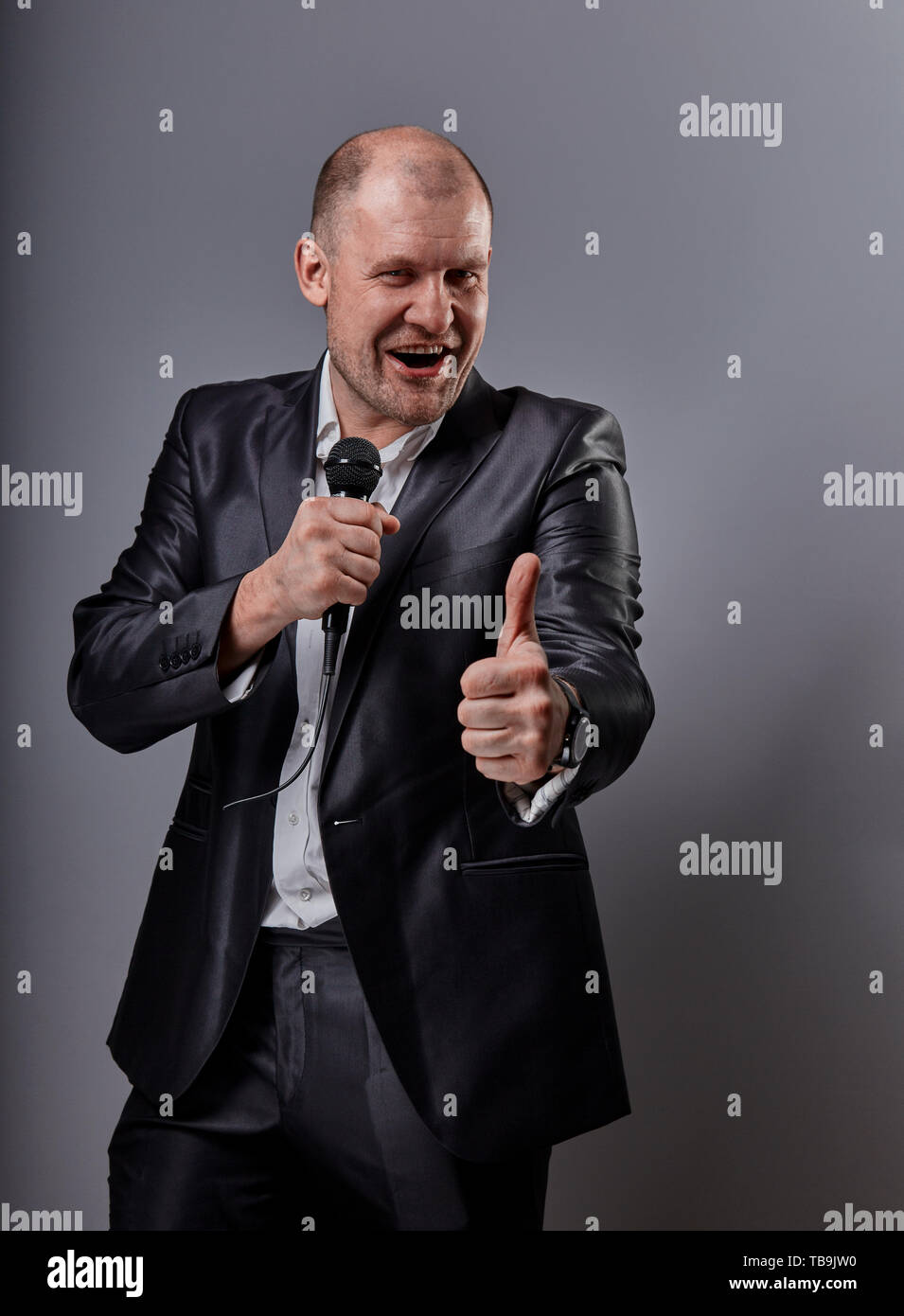 Smiling emotional moving happy performer man presenting the show ...