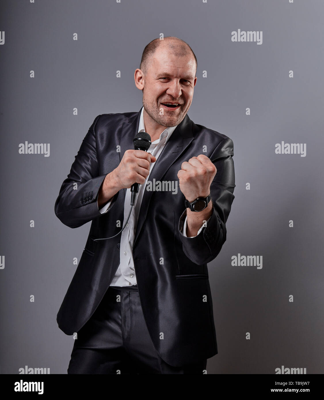 Smiling emotional moving happy performer man presenting the show ...