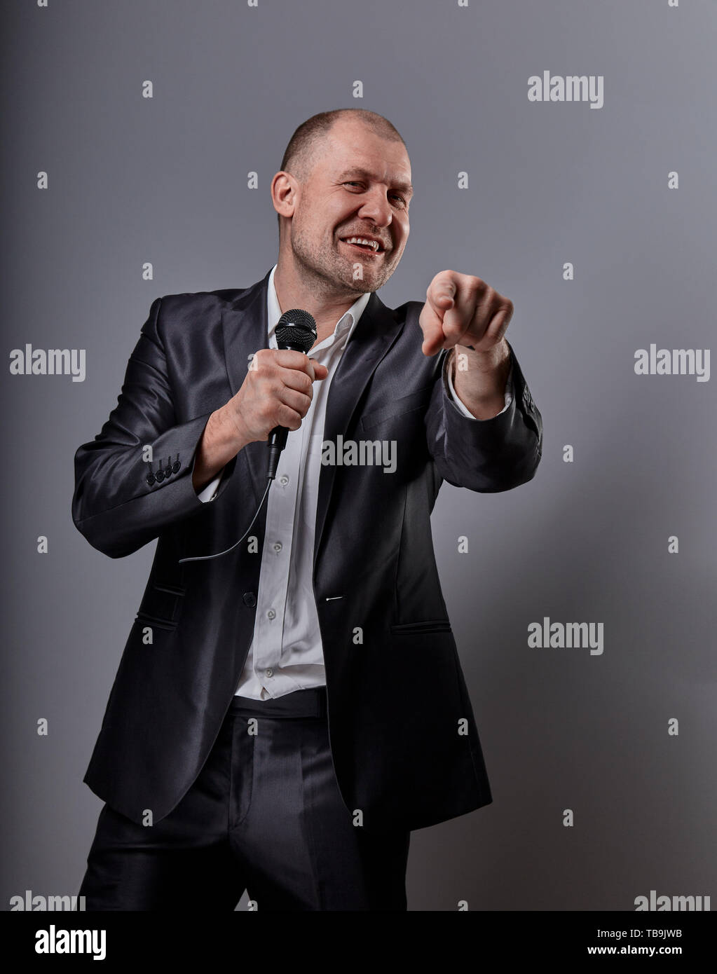 Smiling emotional moving happy performer man presenting the show ...