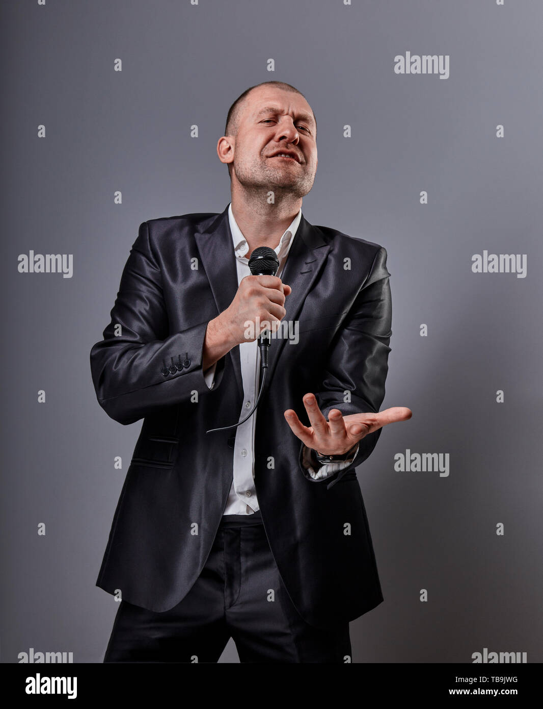 Smiling emotional moving happy performer man presenting the show ...