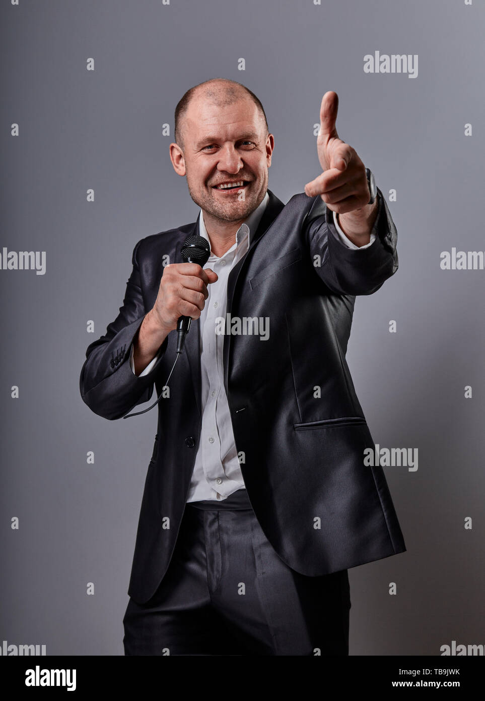 Smiling emotional moving happy performer man presenting the show ...