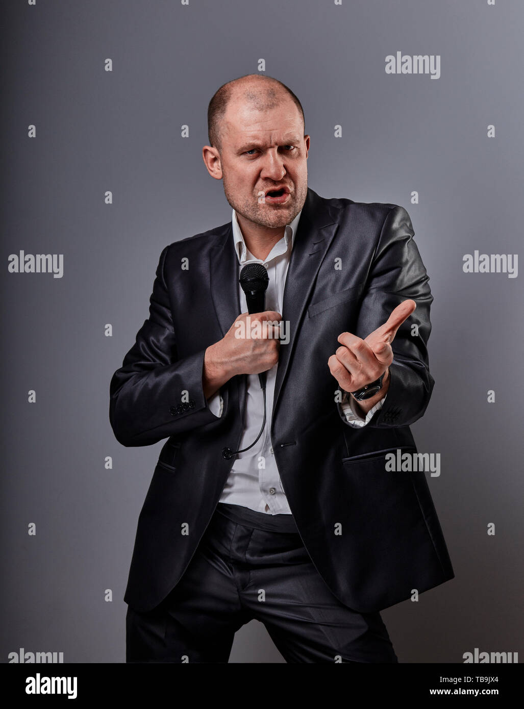 Fun emotional moving happy performer man presenting the show holding ...