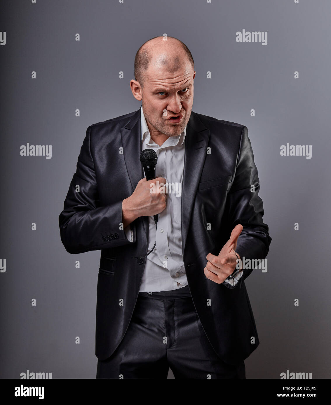 Fun emotional happy performer man presenting the show holding ...