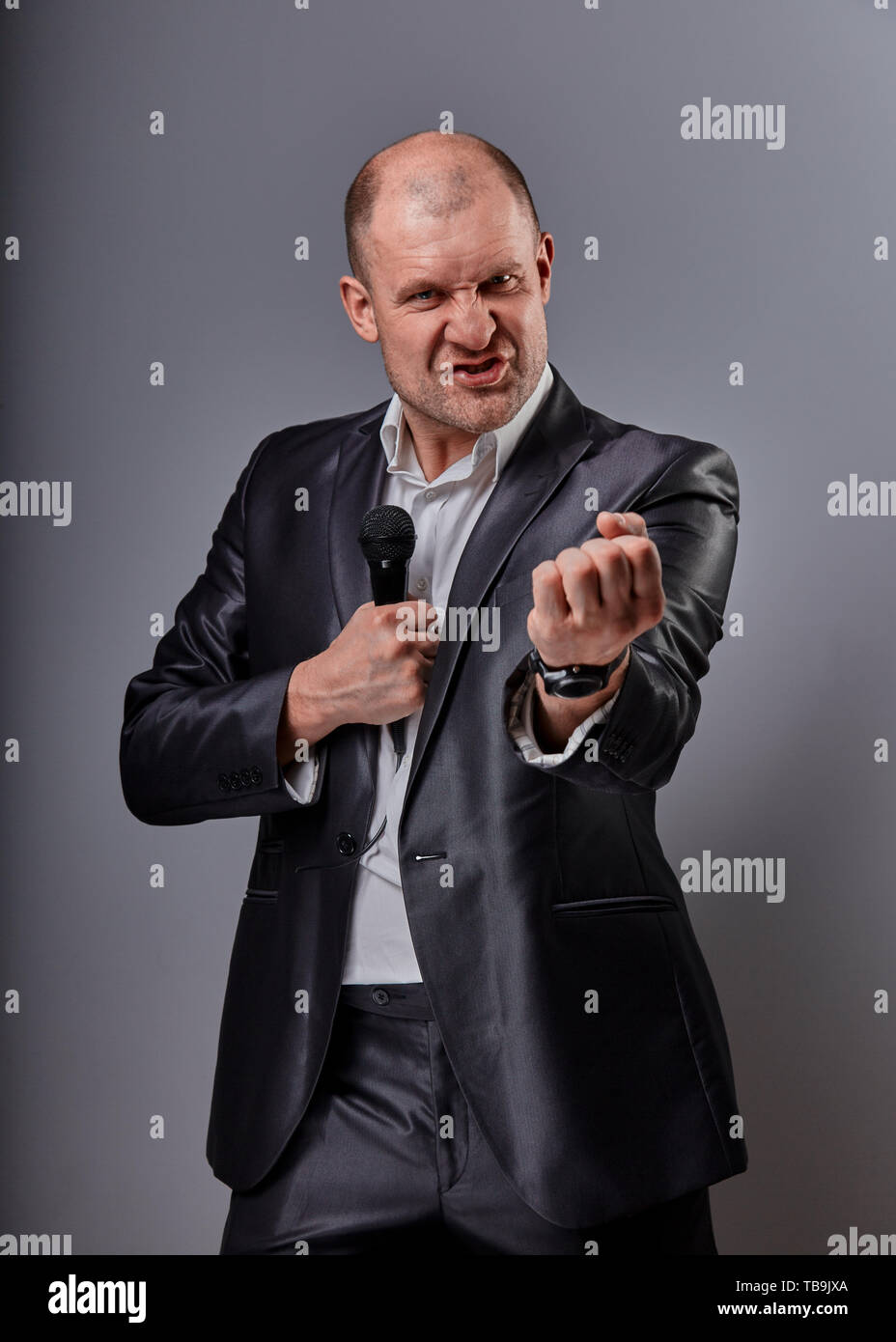 Fun emotional happy performer man presenting the show holding ...