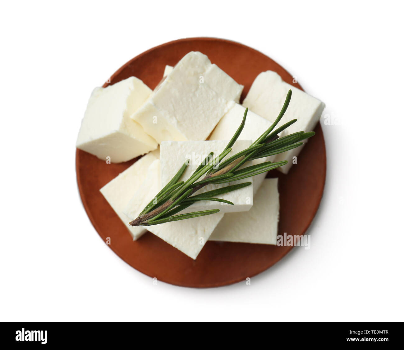Plate with tasty feta cheese on white background Stock Photo - Alamy