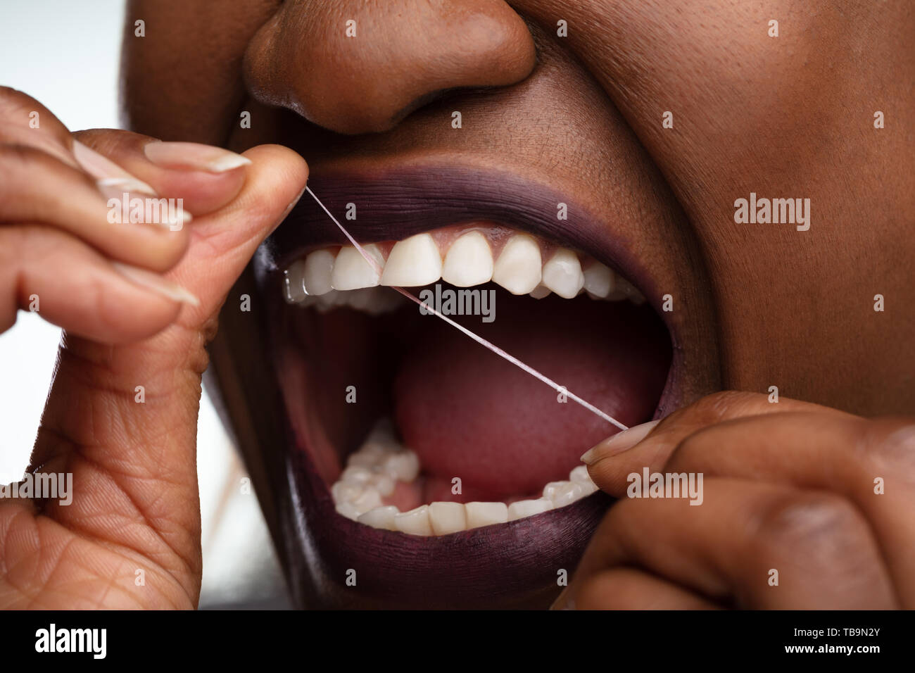 Dental floss pick hi-res stock photography and images - Alamy