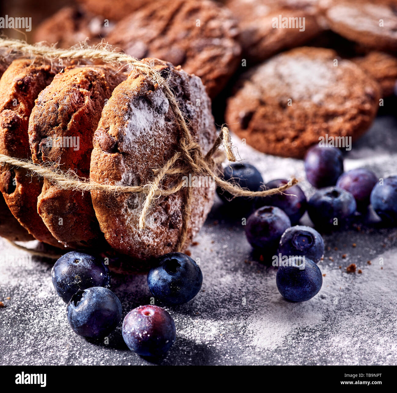 Chocolate chip cookies tied with string. Serving food on slate Stock ...
