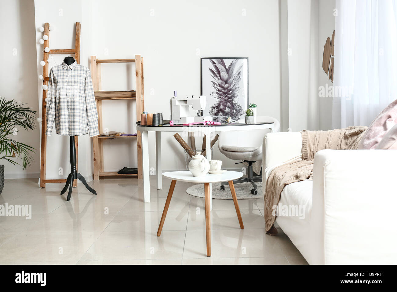 Stylish workplace of tailor with sewing machine in workshop Stock Photo ...