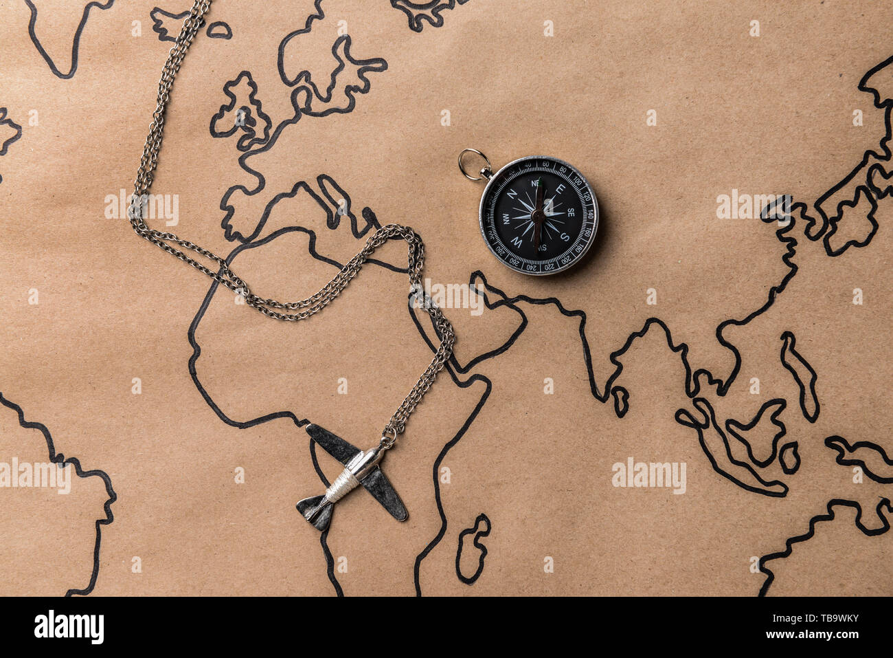 Compass and small metal airplane on world map. Travel concept Stock ...