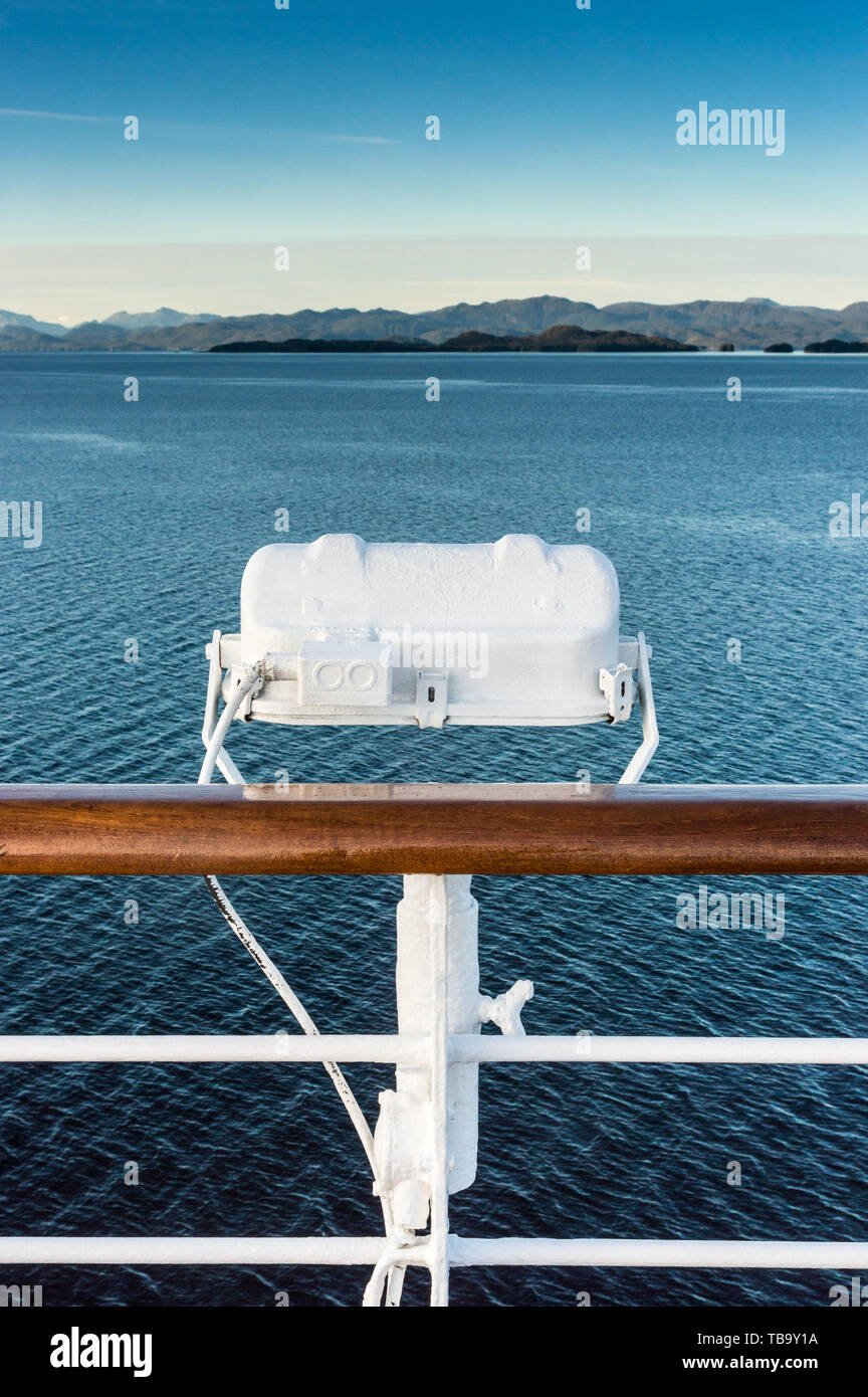 White metal marine exterior light fixture on railing of cruise ship ...