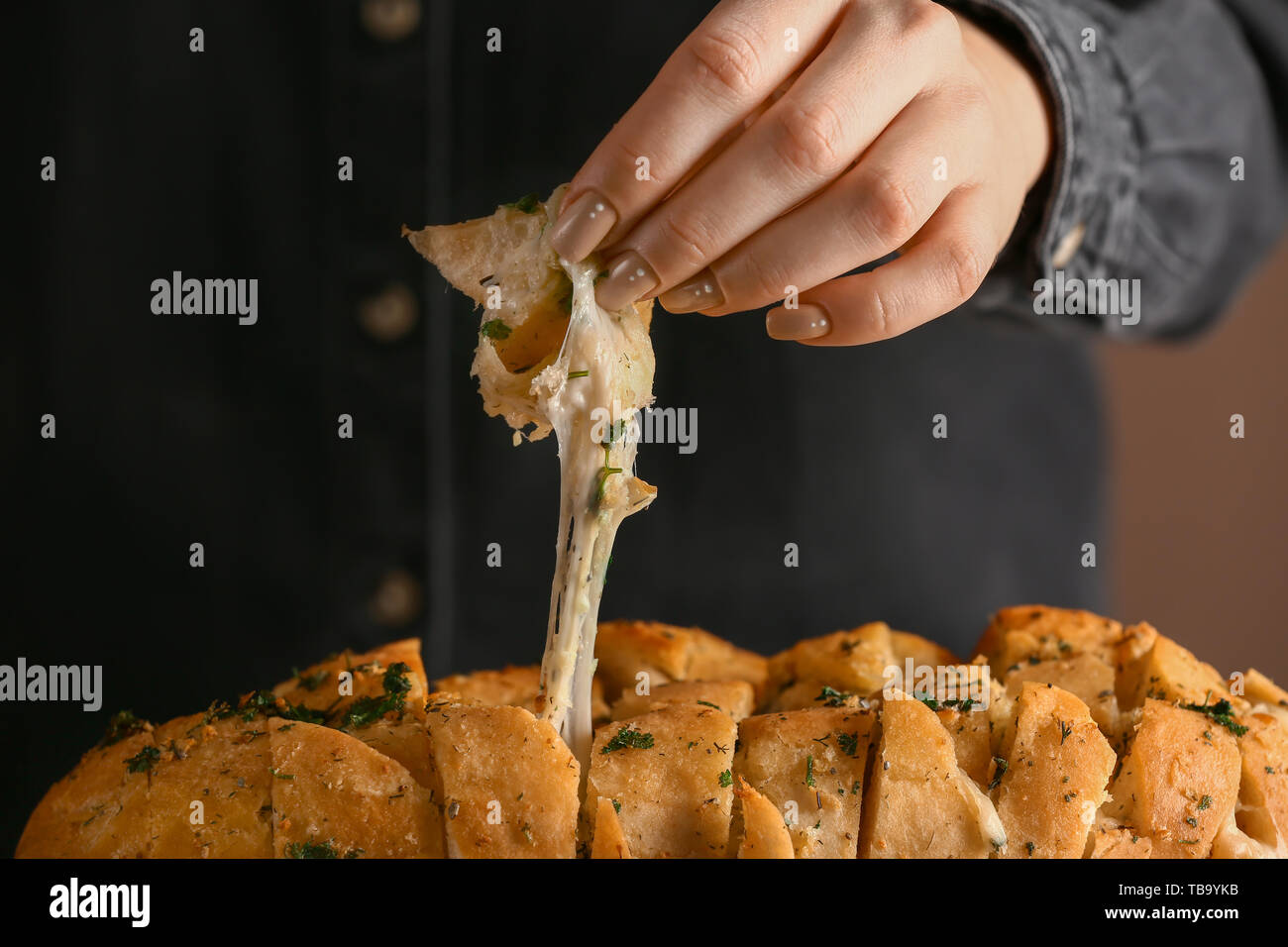 Woman eating garlic bread hi-res stock photography and images - Alamy
