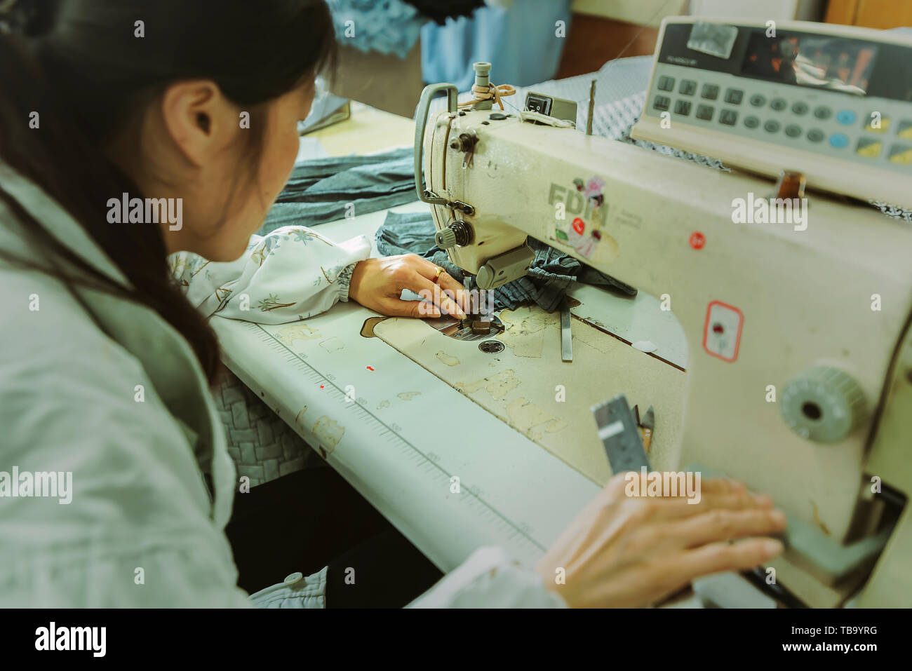 Asian women sewing machine hi-res stock photography and images - Alamy