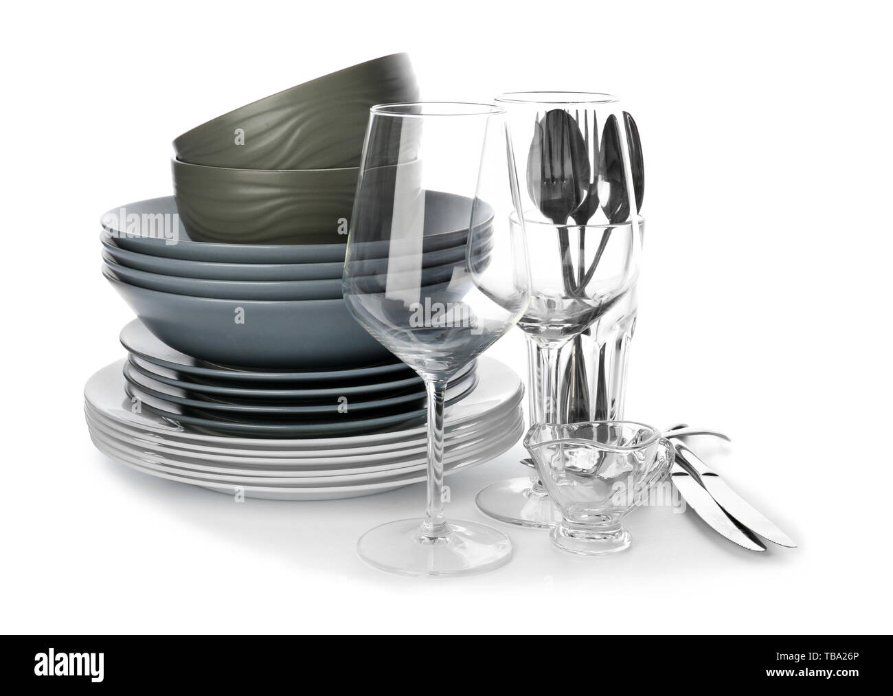Set of clean tableware on white background Stock Photo - Alamy