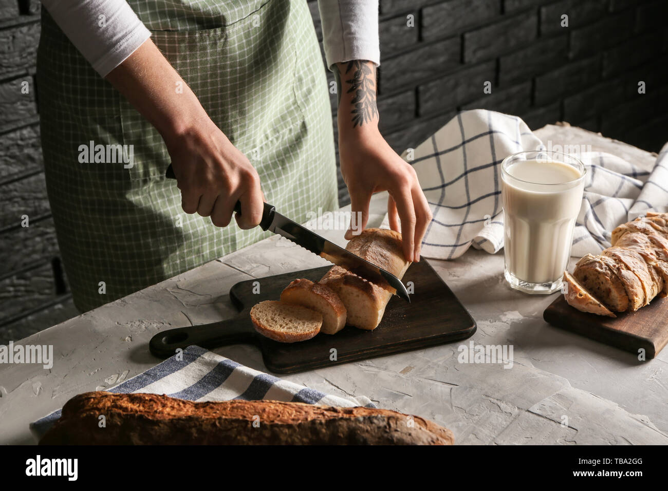 Woman cutting freshly baked hi-res stock photography and images - Alamy