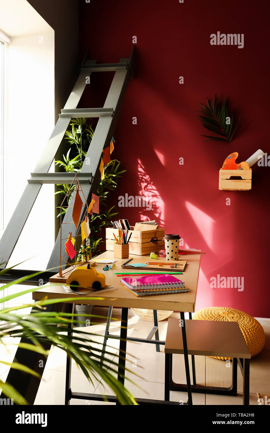 Stylish workplace in interior of painter's workshop Stock Photo - Alamy
