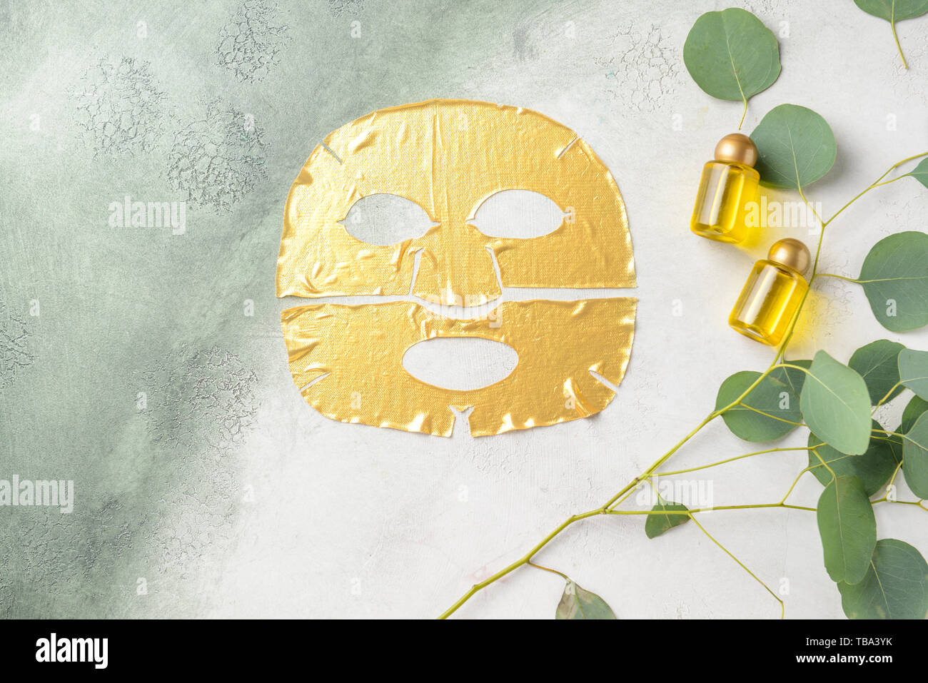 Sheet facial mask with essential oil on light background Stock Photo ...