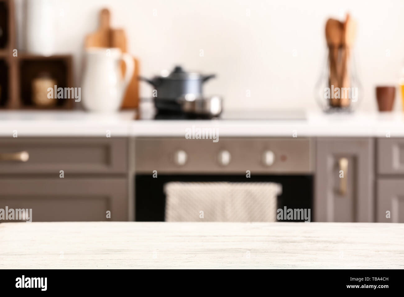 Wooden table in modern kitchen Stock Photo - Alamy