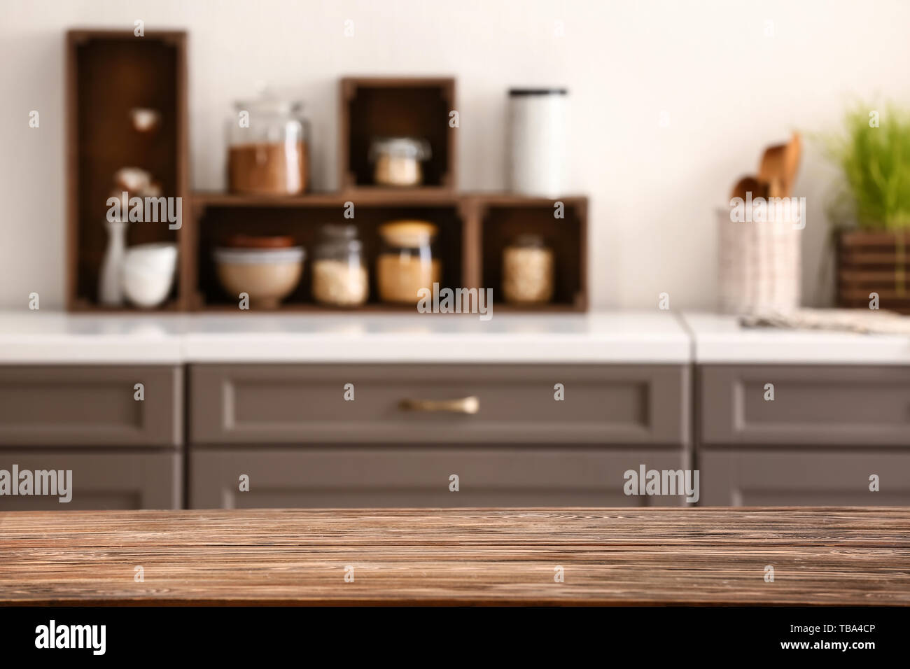 Wooden table in modern kitchen Stock Photo - Alamy