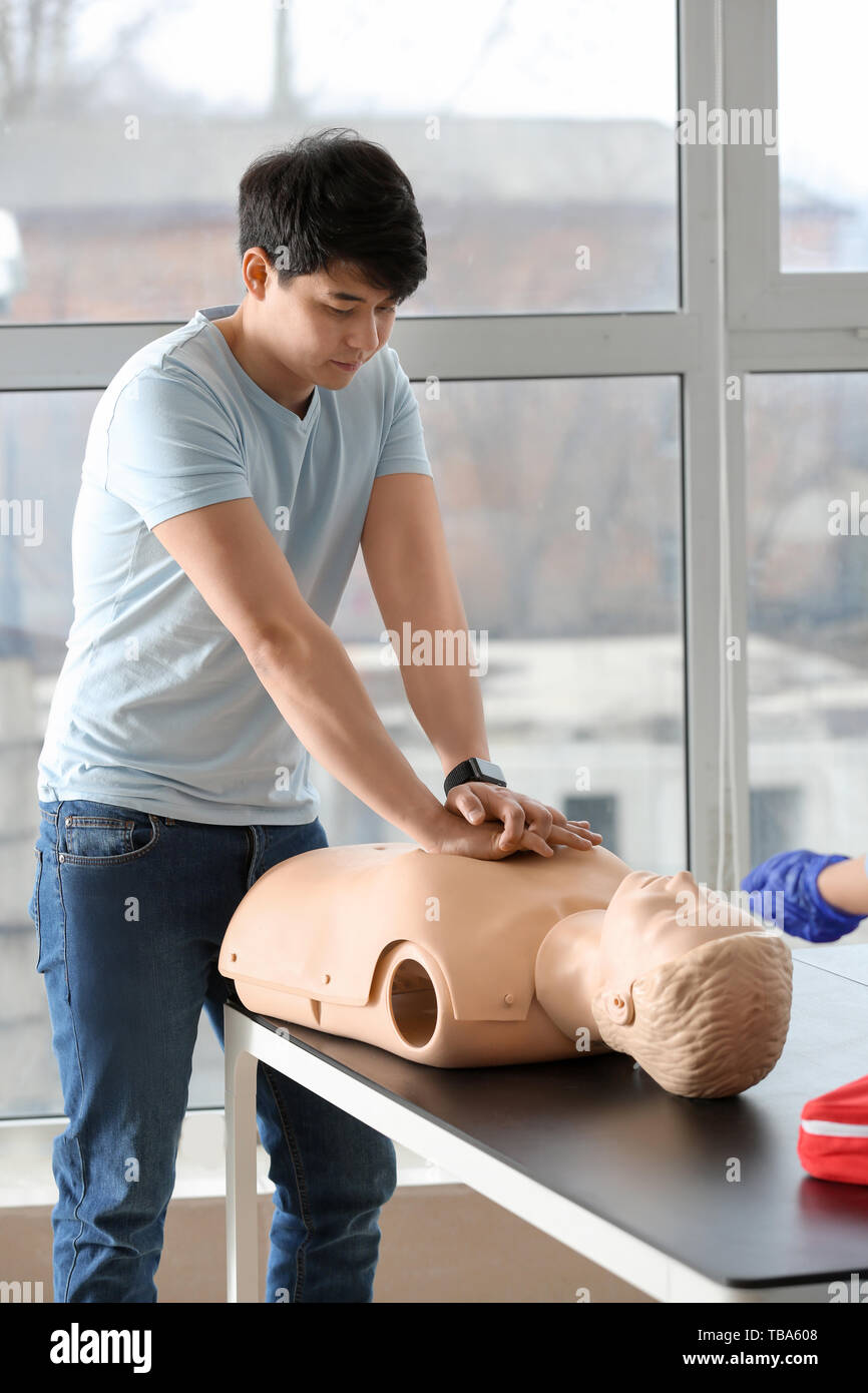 Man learning to perform CPR at first aid training course Stock Photo ...