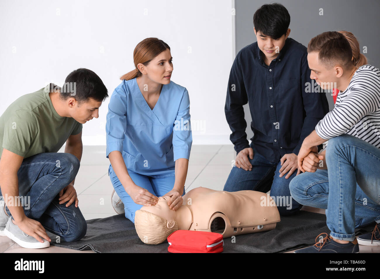 People learning to perform CPR at first aid training course Stock Photo ...
