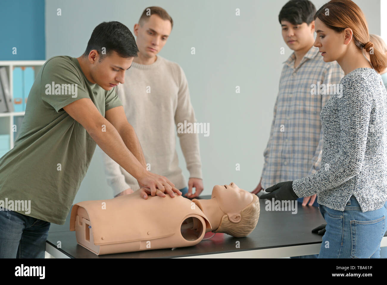 People learning to perform CPR at first aid training course Stock Photo ...