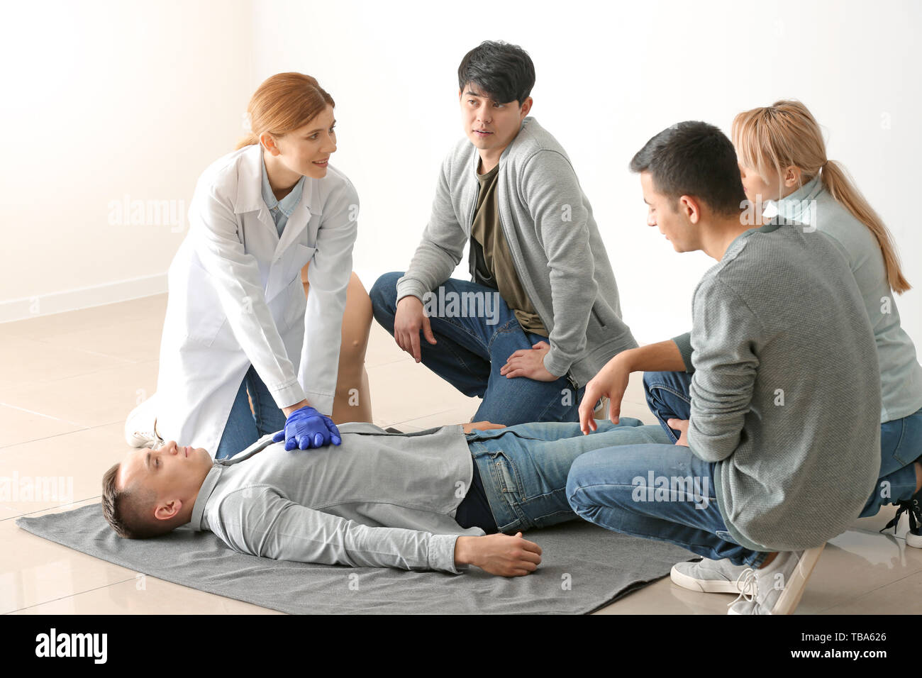 People learning to perform CPR at first aid training course Stock Photo ...