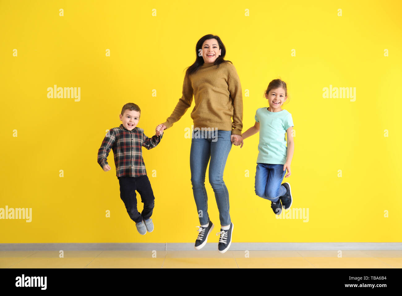 Happy jumping family hi-res stock photography and images - Alamy