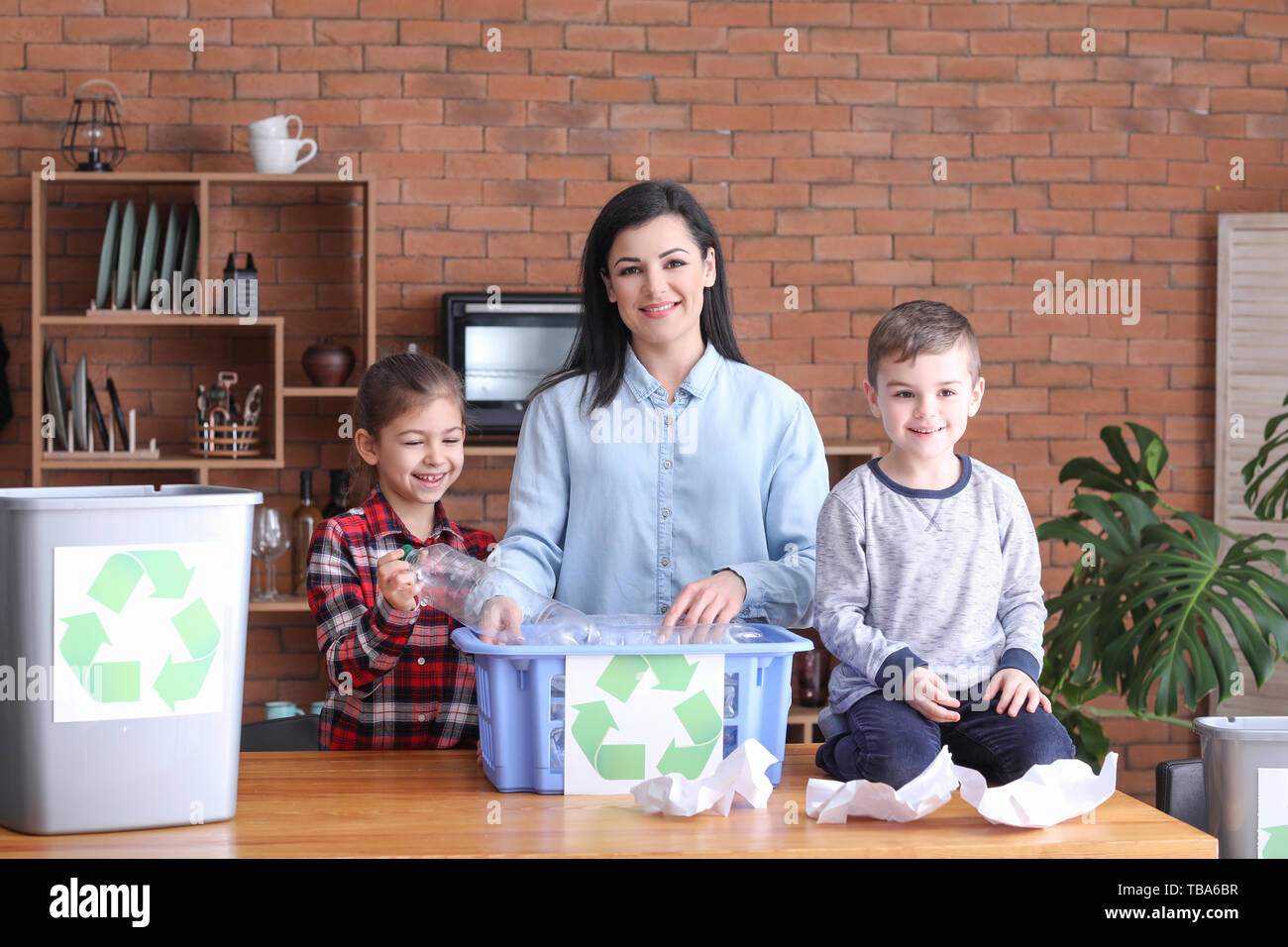 Family sorting garbage at home. Concept of recycling Stock Photo - Alamy