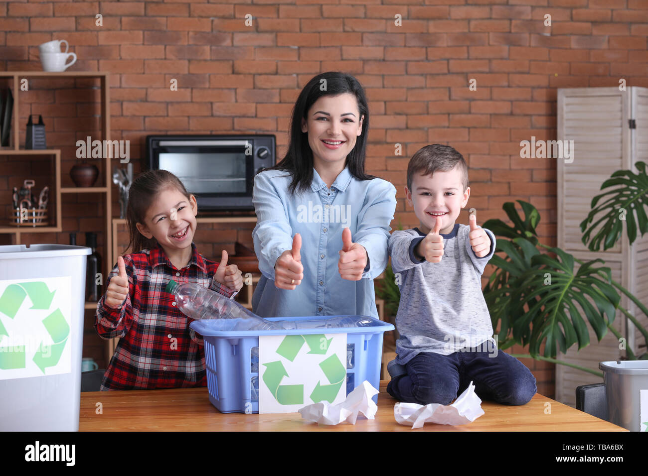 Family sorting garbage at home. Concept of recycling Stock Photo - Alamy